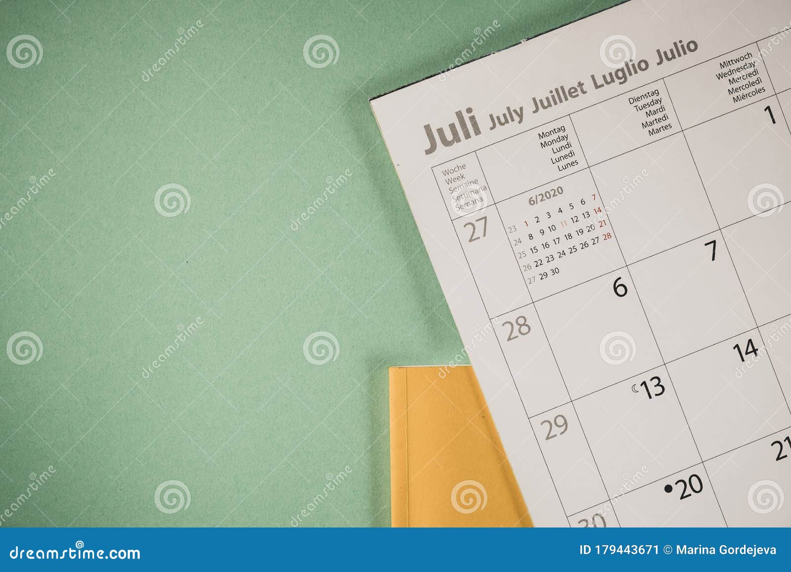 White Clean Calendar with Yellow Notepad on Pastel Green Background ...