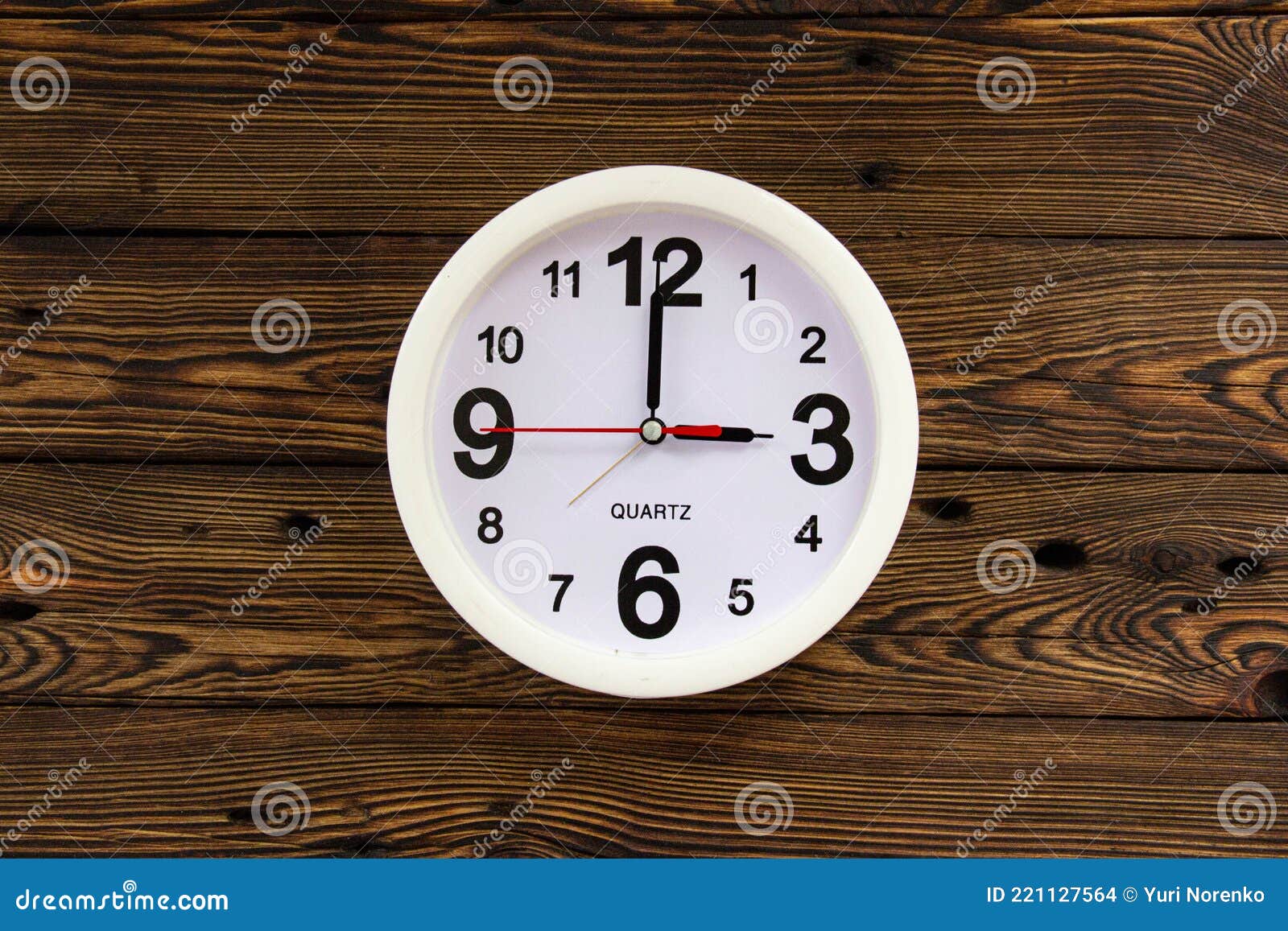 A White Clock Showing the Time on a Wooden Wall Stock Photo - Image of ...
