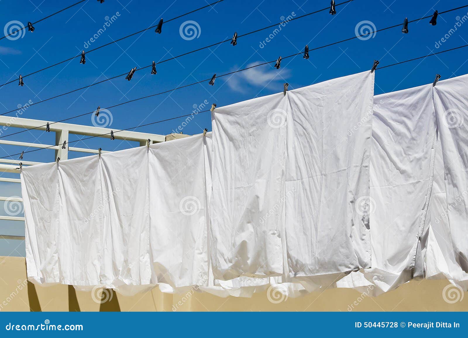 White Clothes Hanging on the Line Against Blue Sky. Stock Photo - Image ...