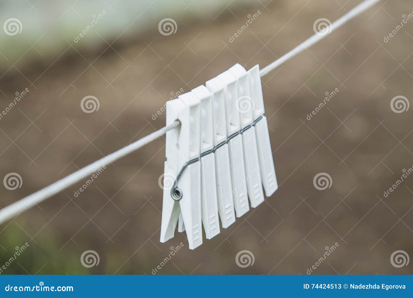White Clothespin on the Rope Stock Image - Image of clothesline ...