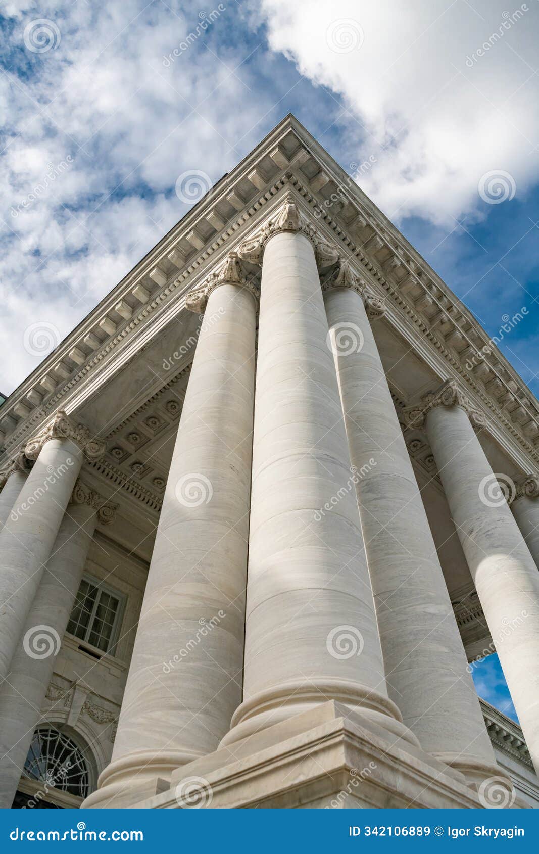 White Clouds Above the Monumental Columns. View from Bottom To Top ...