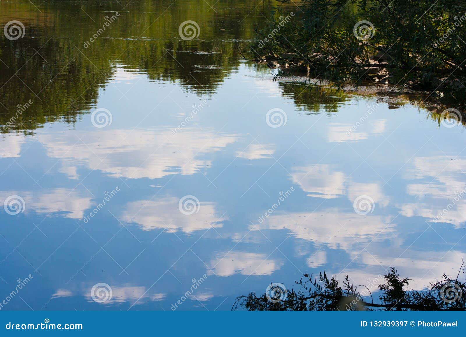 White Clouds are Reflected from the Water`s Surface. Stock Image ...