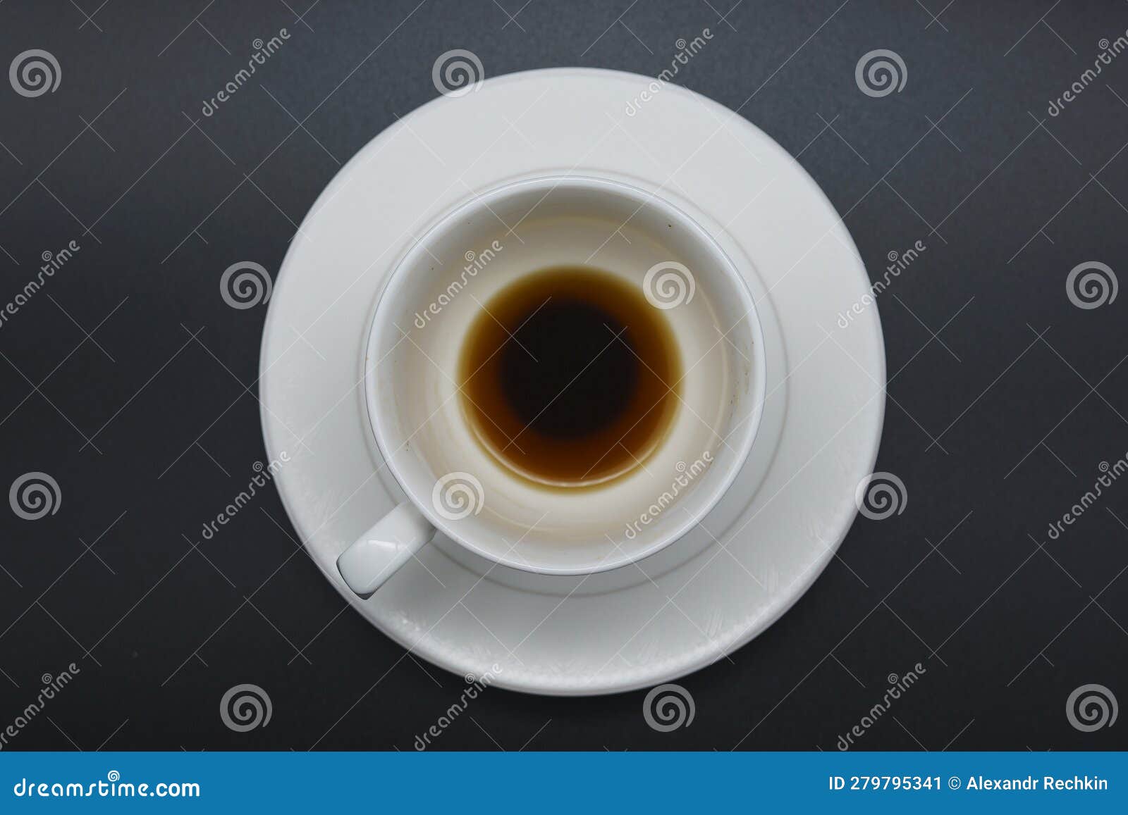 White Coffee Porcelain Cup with the Remains of Coffee Grounds on the ...