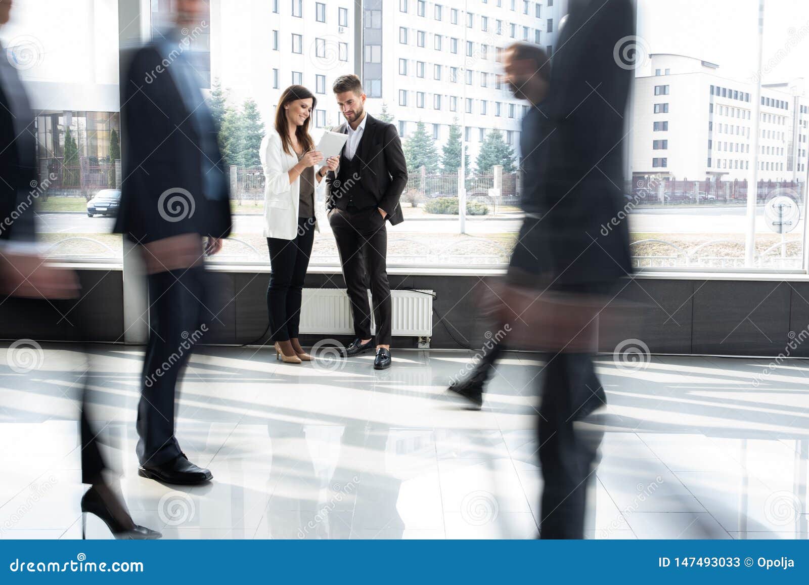 White Collar Workers Going Down Office Corridor during Working Day ...