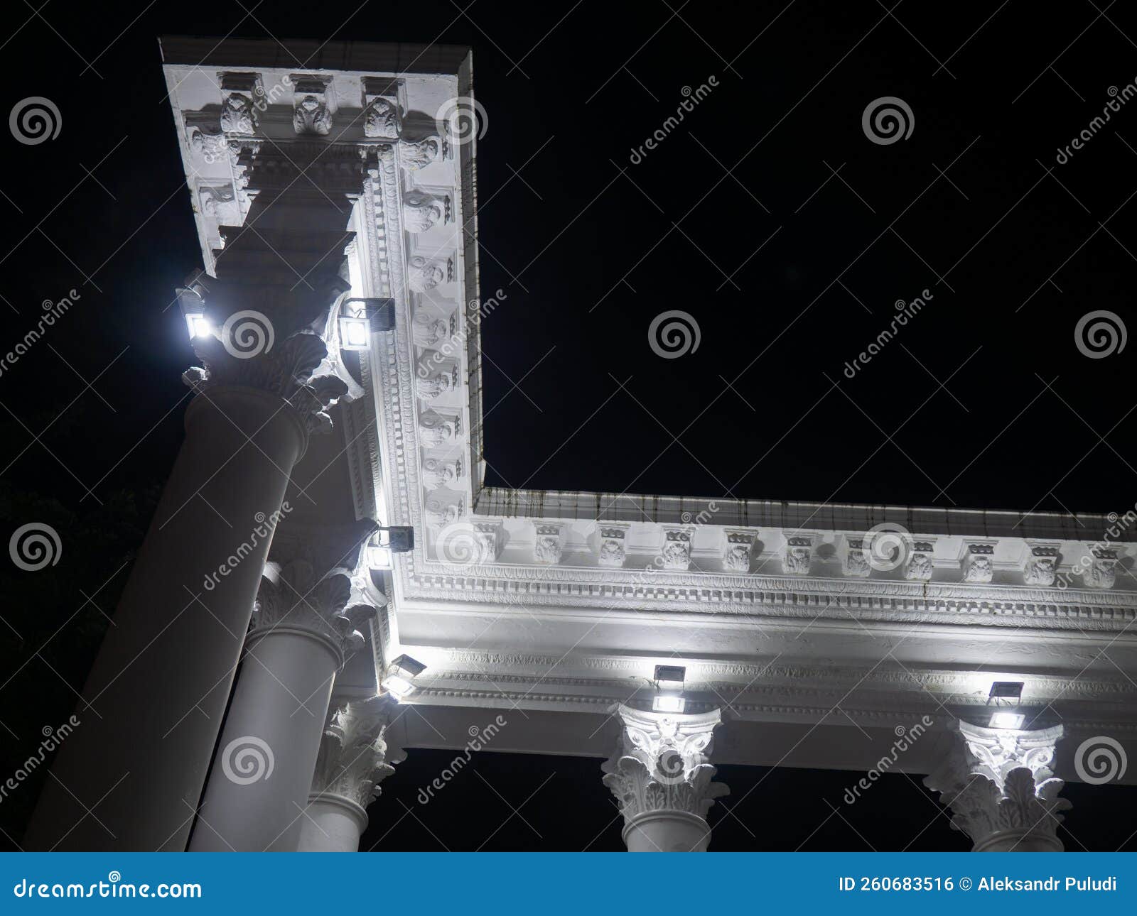 White Colonnade in the Dark. White Columns in the Light of Spotlights ...