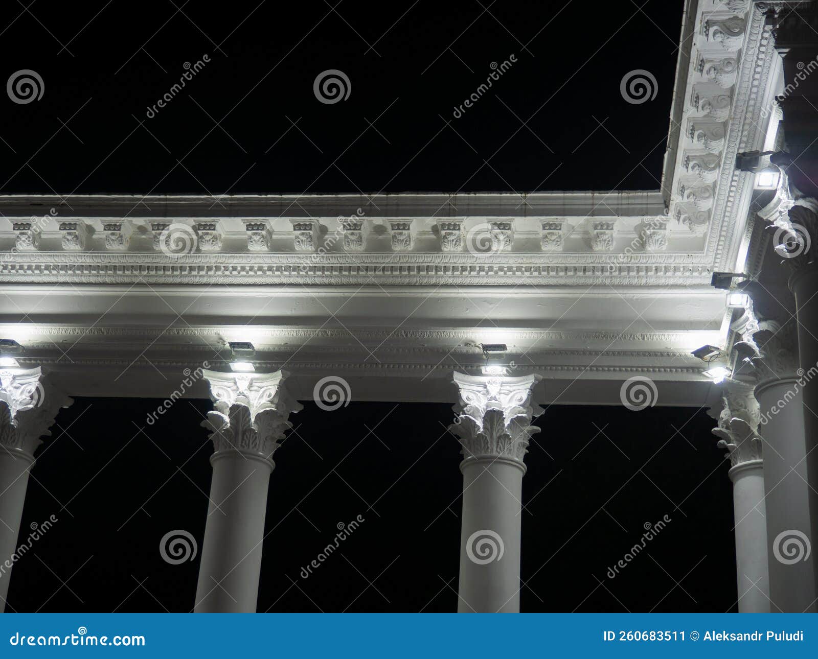 White Colonnade in the Dark. White Columns in the Light of Spotlights ...