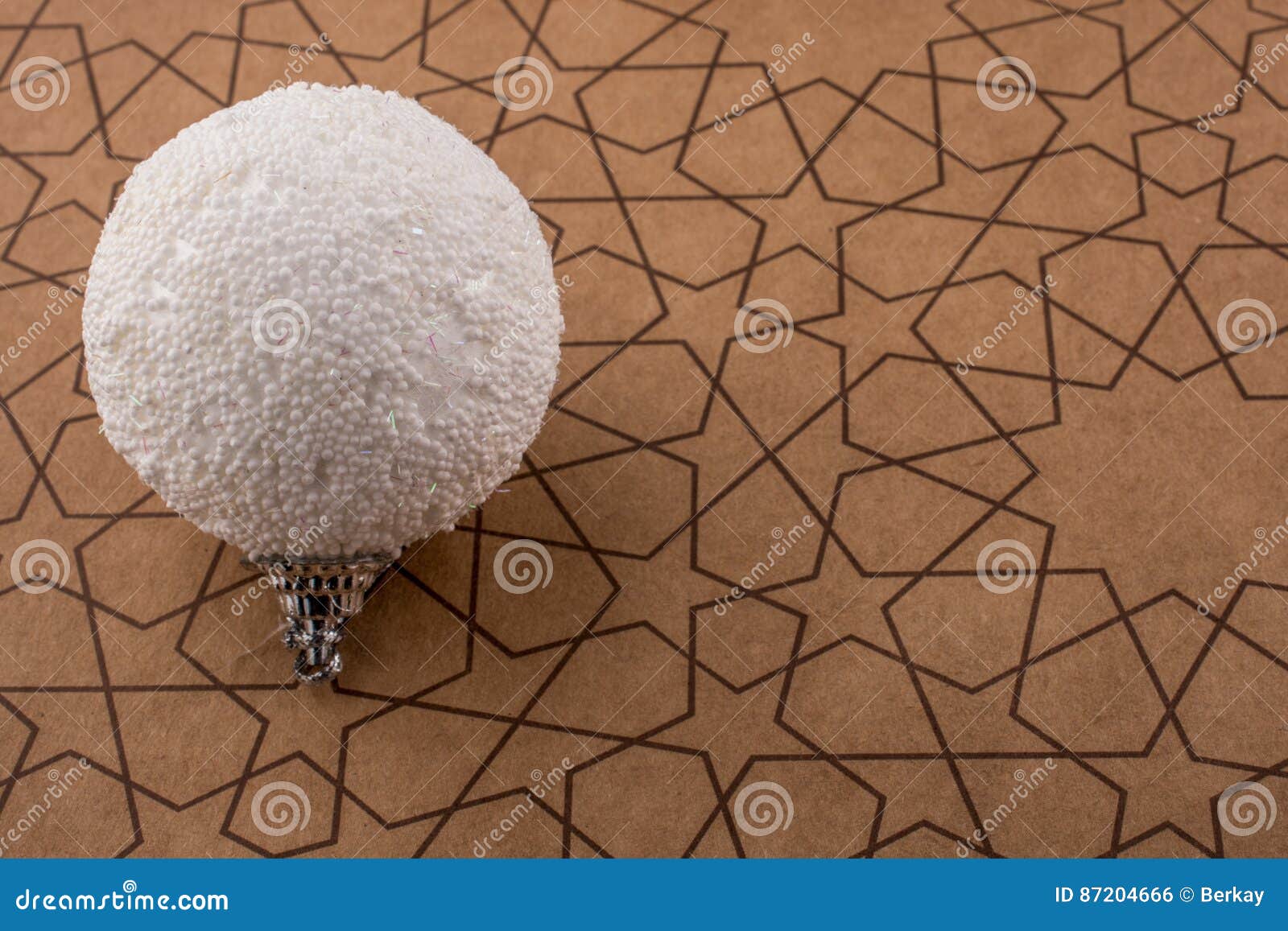 White Color Decorative Ball on a Paper with Pattern Stock Photo - Image ...