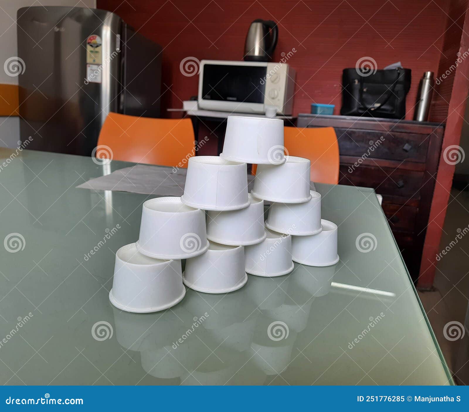 White Color Paper Coffee Cup Tower or Pyramid in the Table Stock Image ...