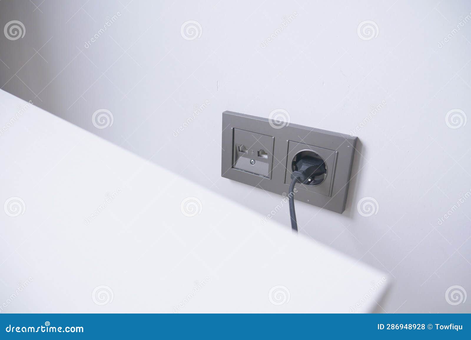 White Color Power Cord Cable Plugged into Wall Stock Photo - Image of ...