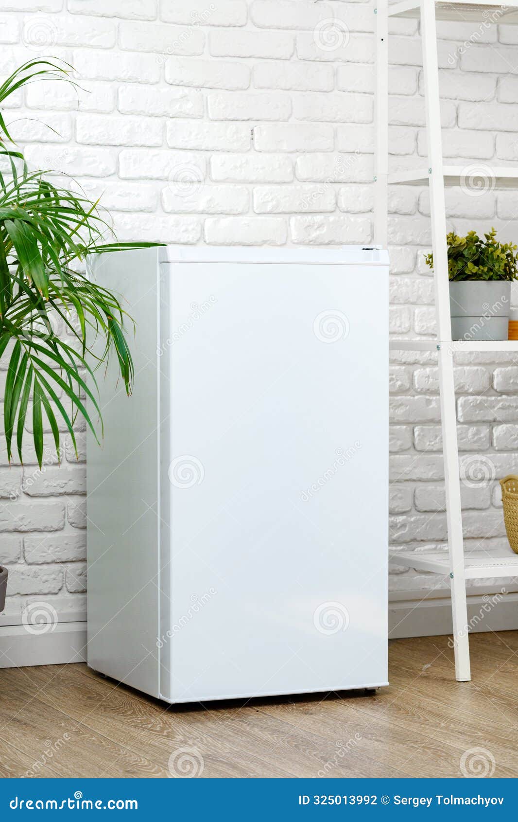 White Compact Refrigerator in a Modern Kitchen Stock Photo - Image of ...