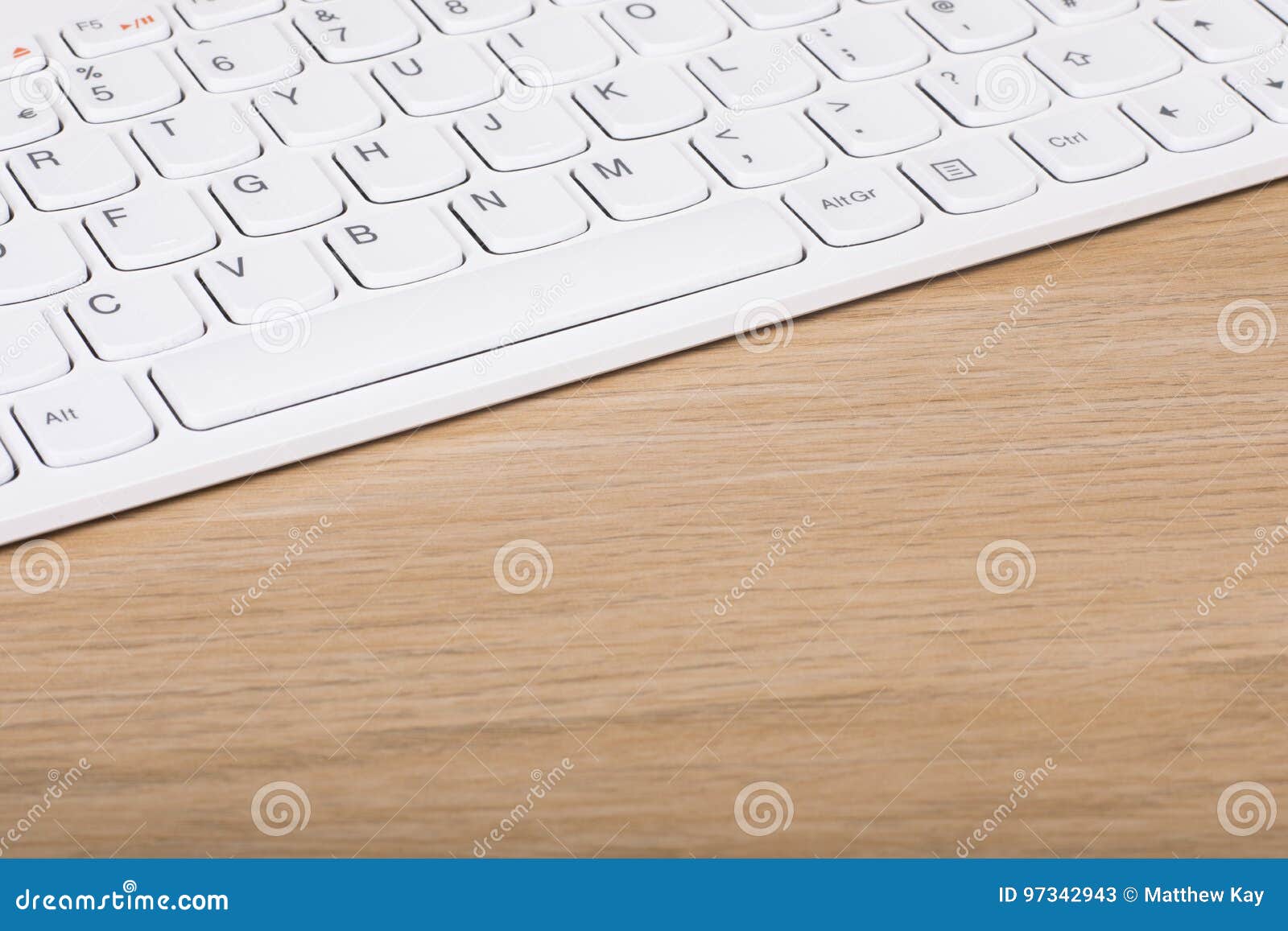 White Computer Keyboard on a Wooden Desk Stock Image - Image of ...