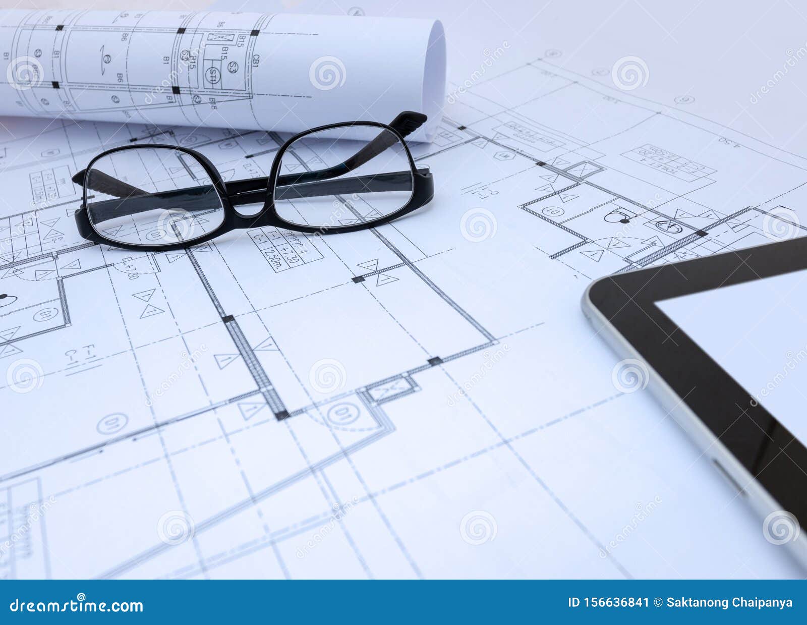 White Construction Design Sheet with Glasses Placed and a Tablet. Stock ...