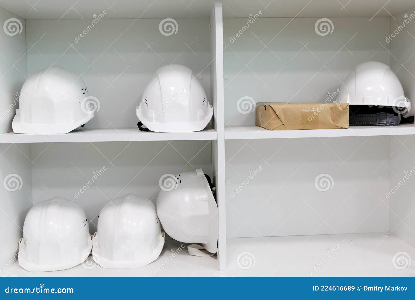 On the Shelf There are White Construction Helmets. a Special Headgear ...