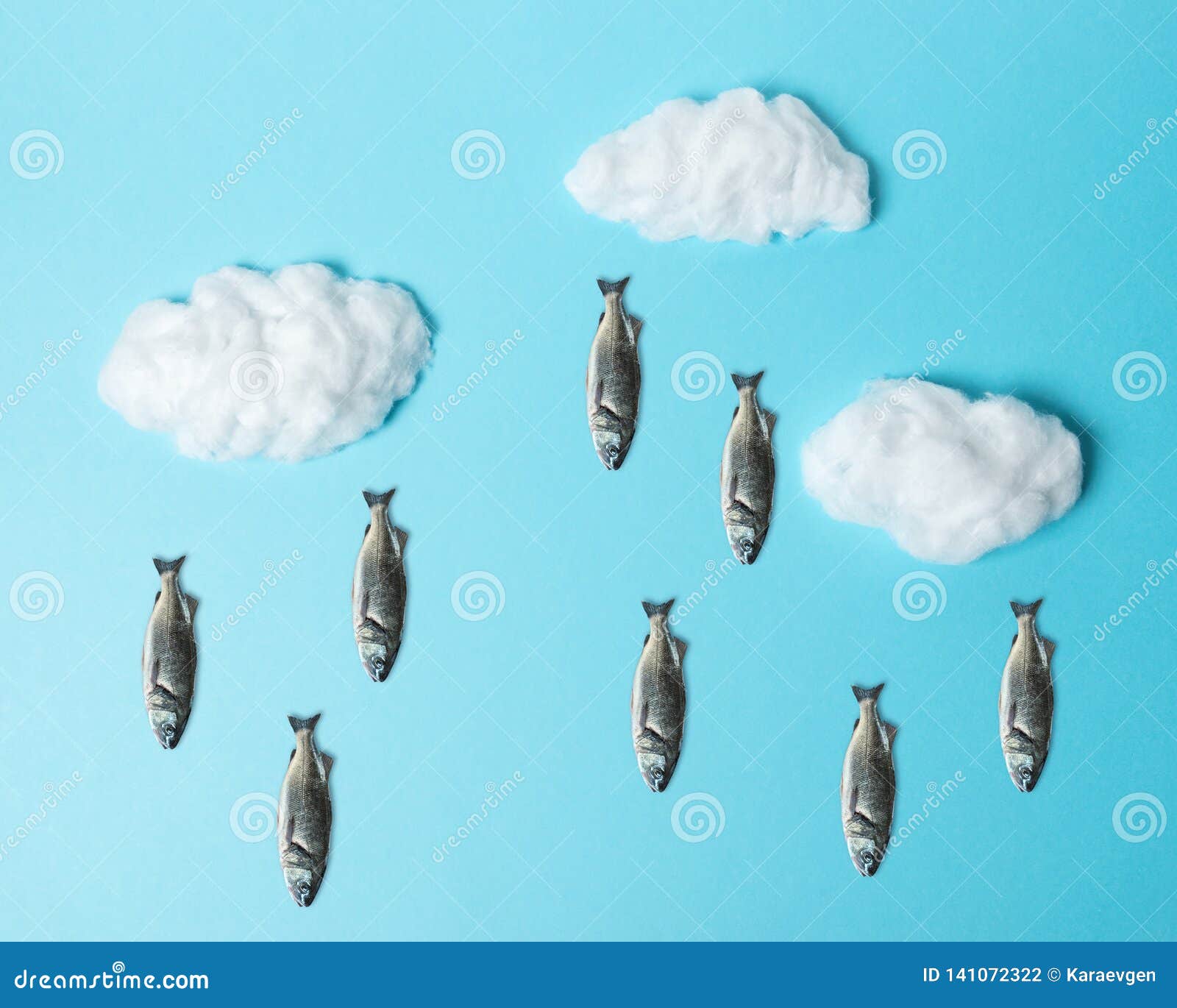 White Cotton Clouds with Fish on Pastel Blue Background. Minimal ...