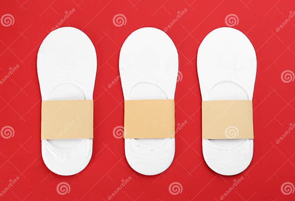 White Cotton Socks on Red Background, Flat Lay Stock Photo - Image of ...