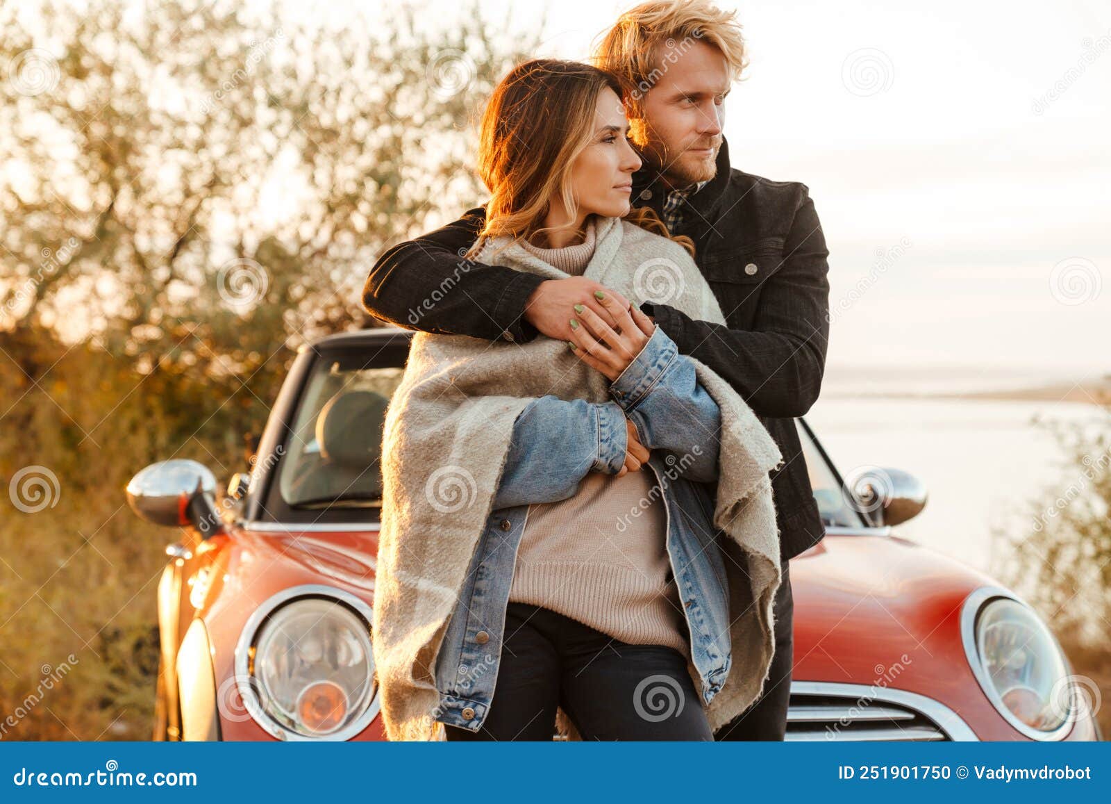 White Couple Hugging while Standing by Car during Trip Stock Photo ...
