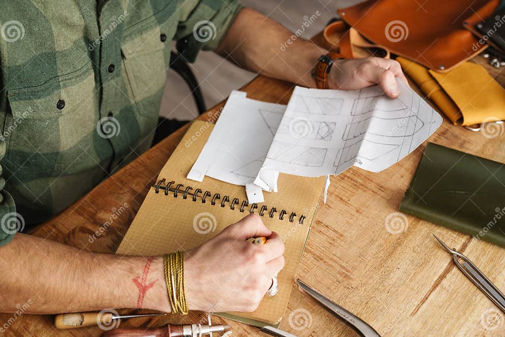 White Craftsman Drawing while Working with Leather Stock Image - Image ...