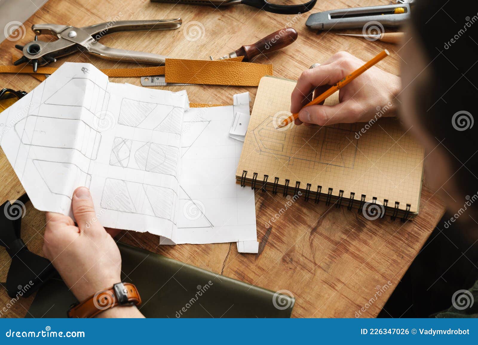 White Craftsman Drawing while Working with Leather Stock Photo - Image ...