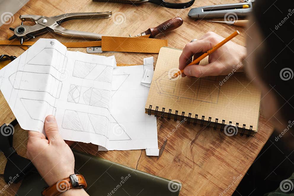 White Craftsman Drawing while Working with Leather Stock Photo - Image ...