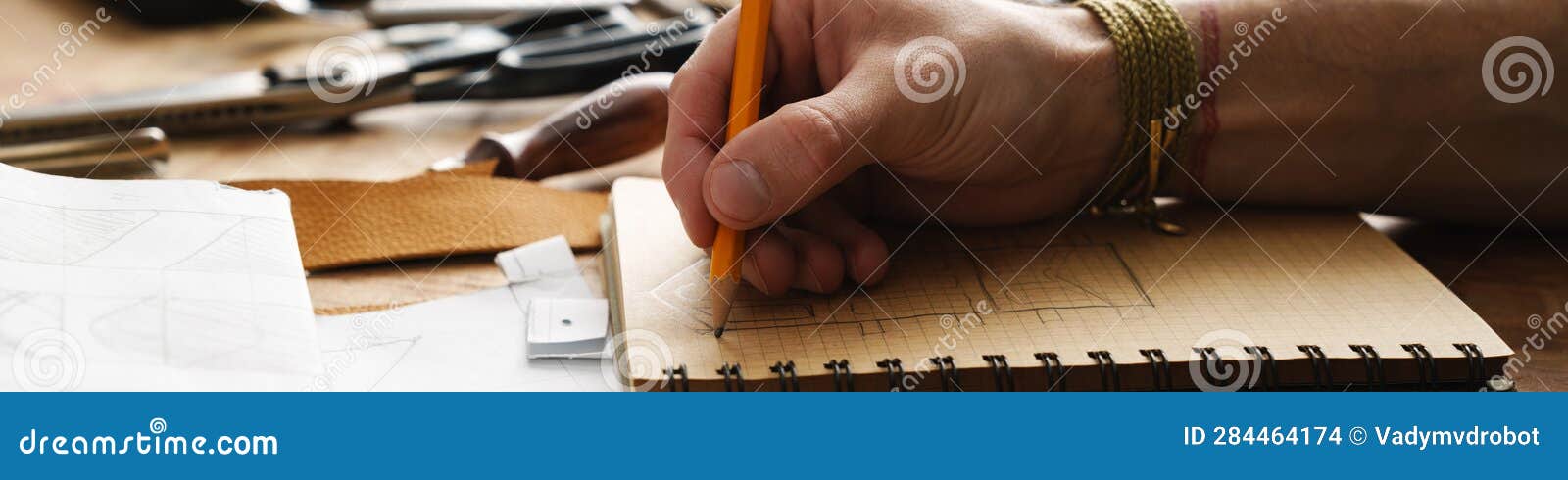 Craftsman Drawing while Working with Leather in Workshop Stock Photo ...
