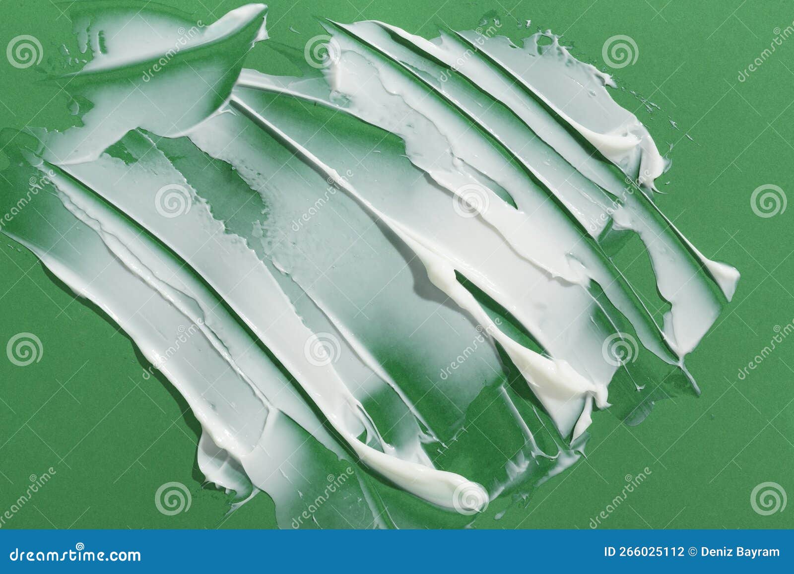 White Cream of Various Shapes on a Green Background Stock Photo - Image ...