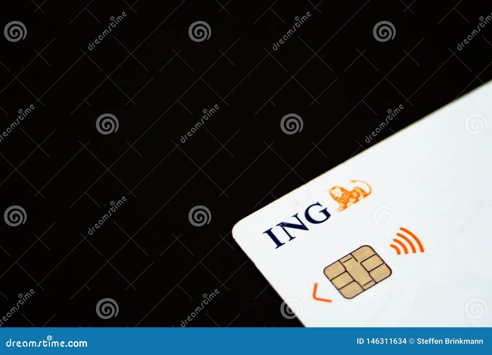 White Credit Card on Plain Black Background with the Logo of ING ...