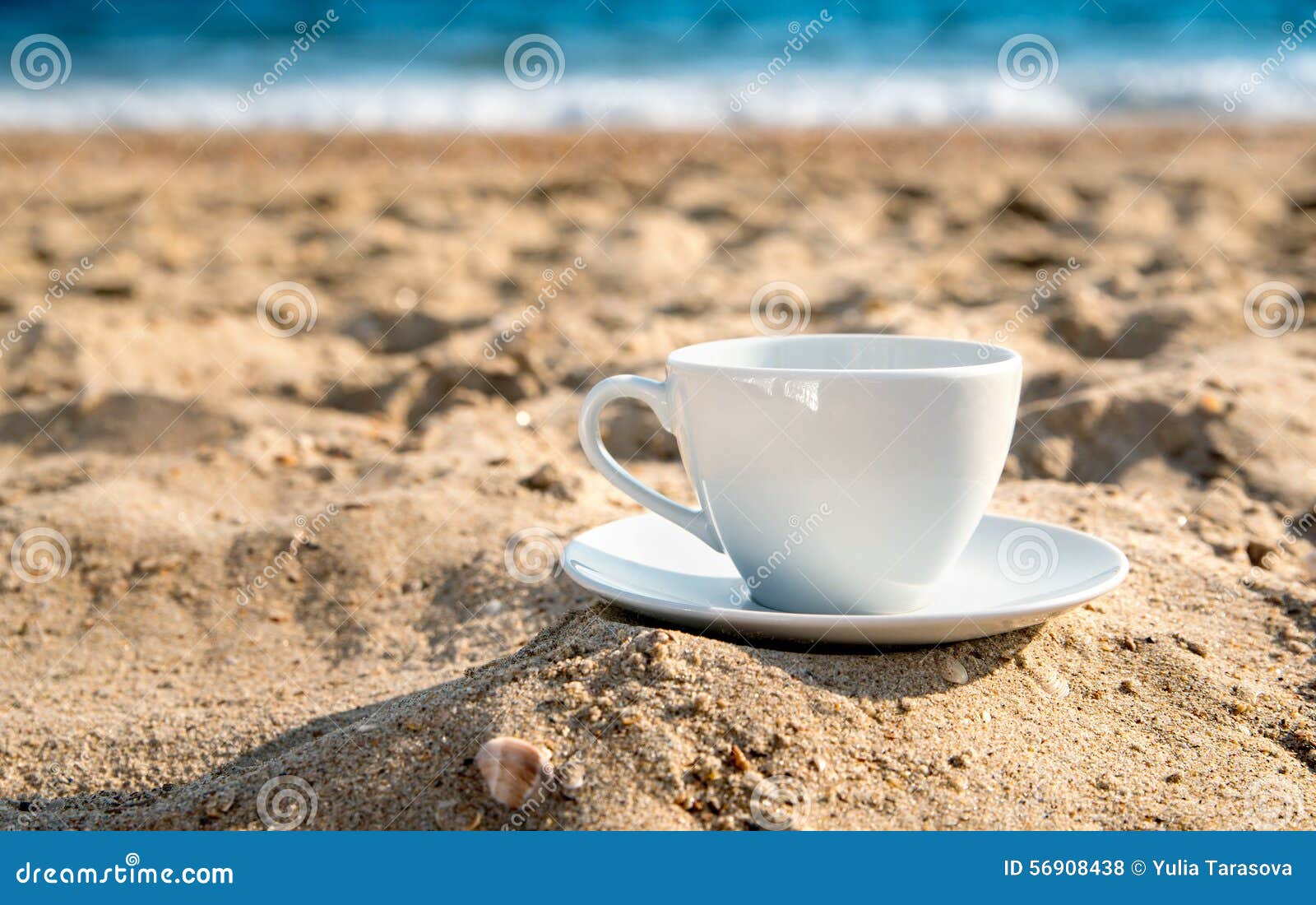 White Cup with Tea or Coffee on Sand Beach Front of Sea Stock Photo ...