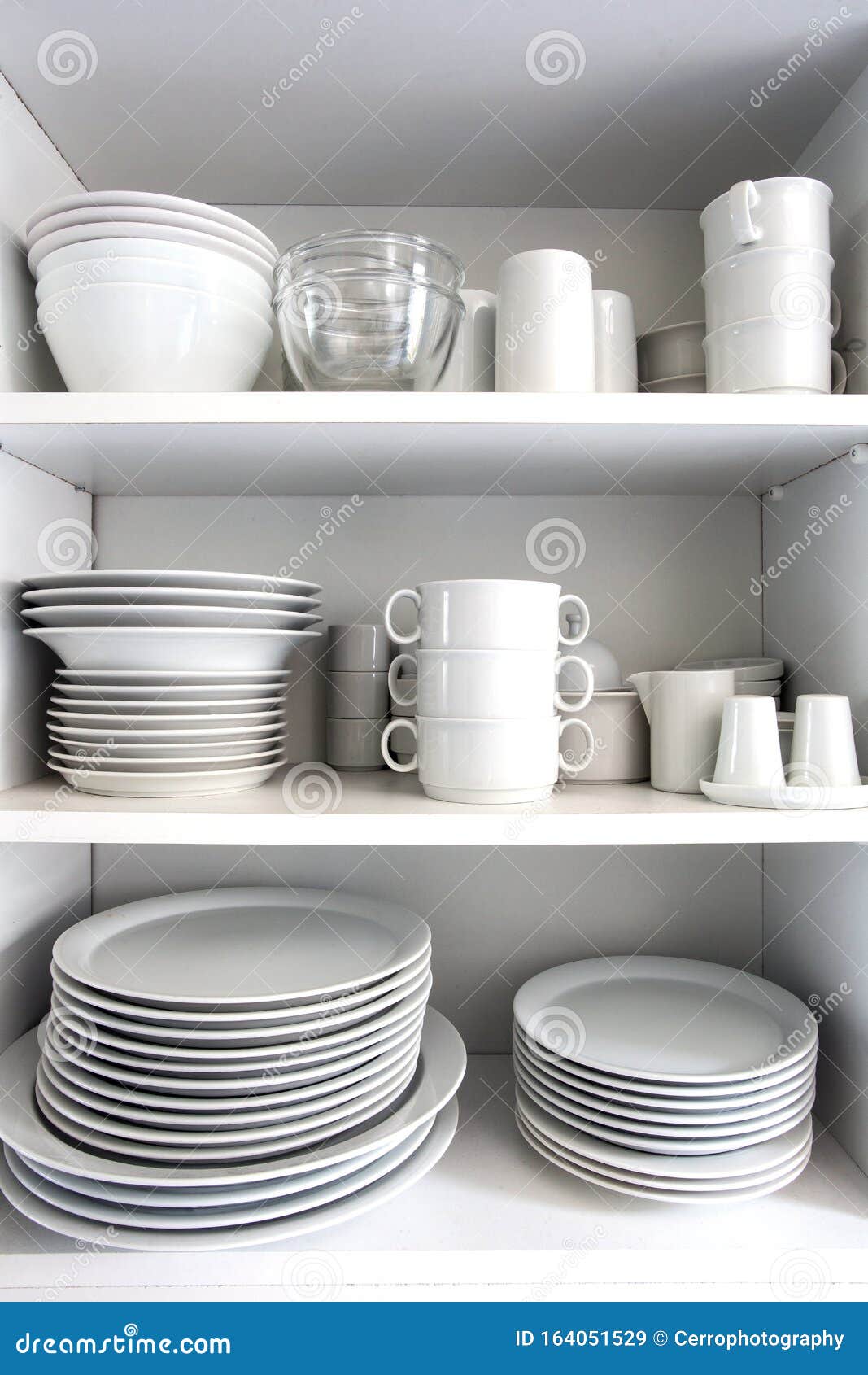 White Cupboard with White Crockery in the Kitchen, Various Clean Dishes ...