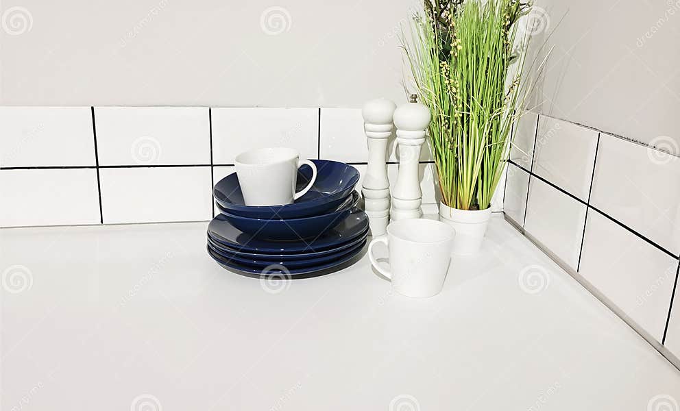 White Cups and Blue Saucers in a Stack on a Table in a Bright Kitchen ...