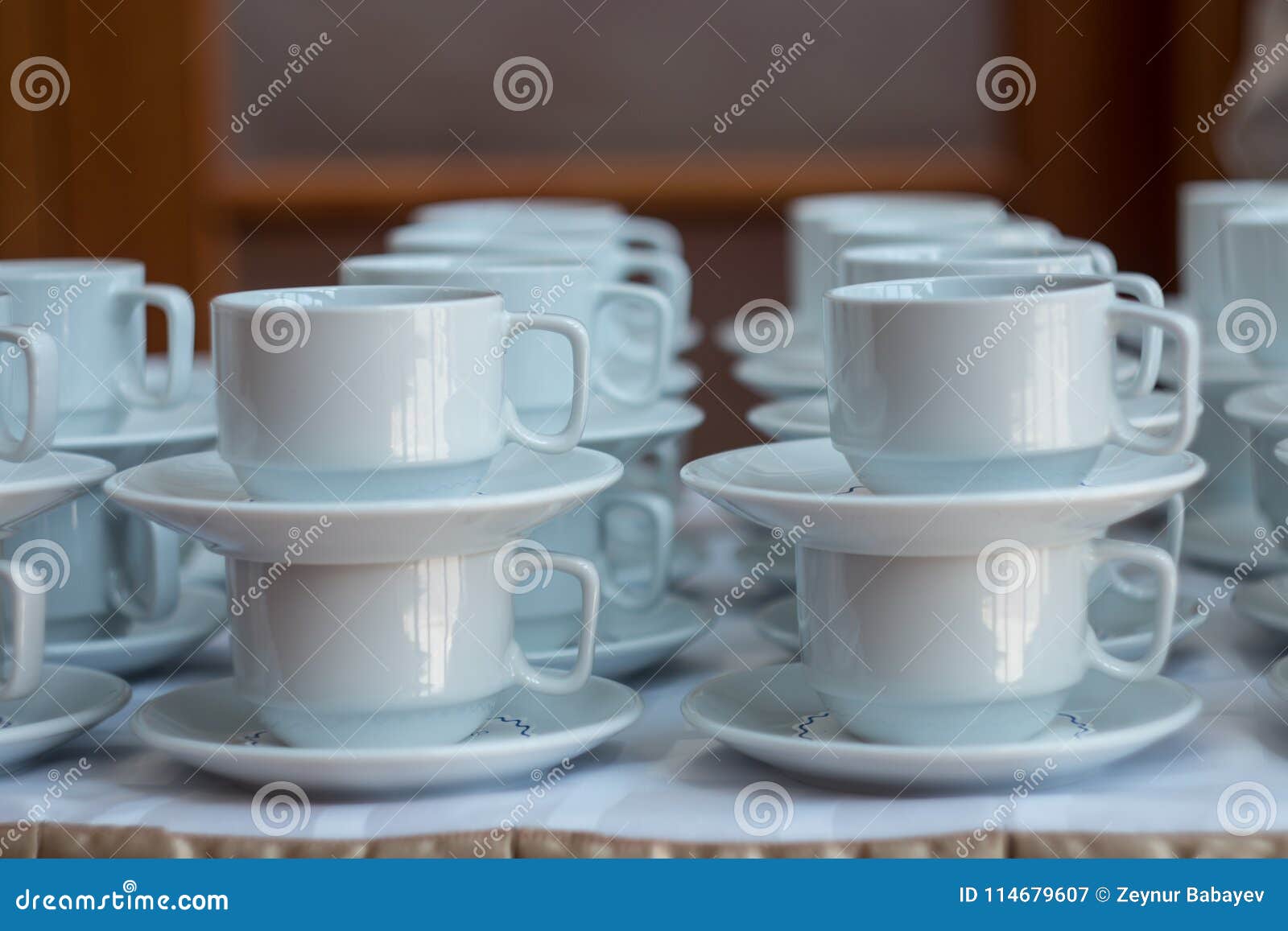 White Cups for Tea Piled on Table with Plates for Coffee-break ...