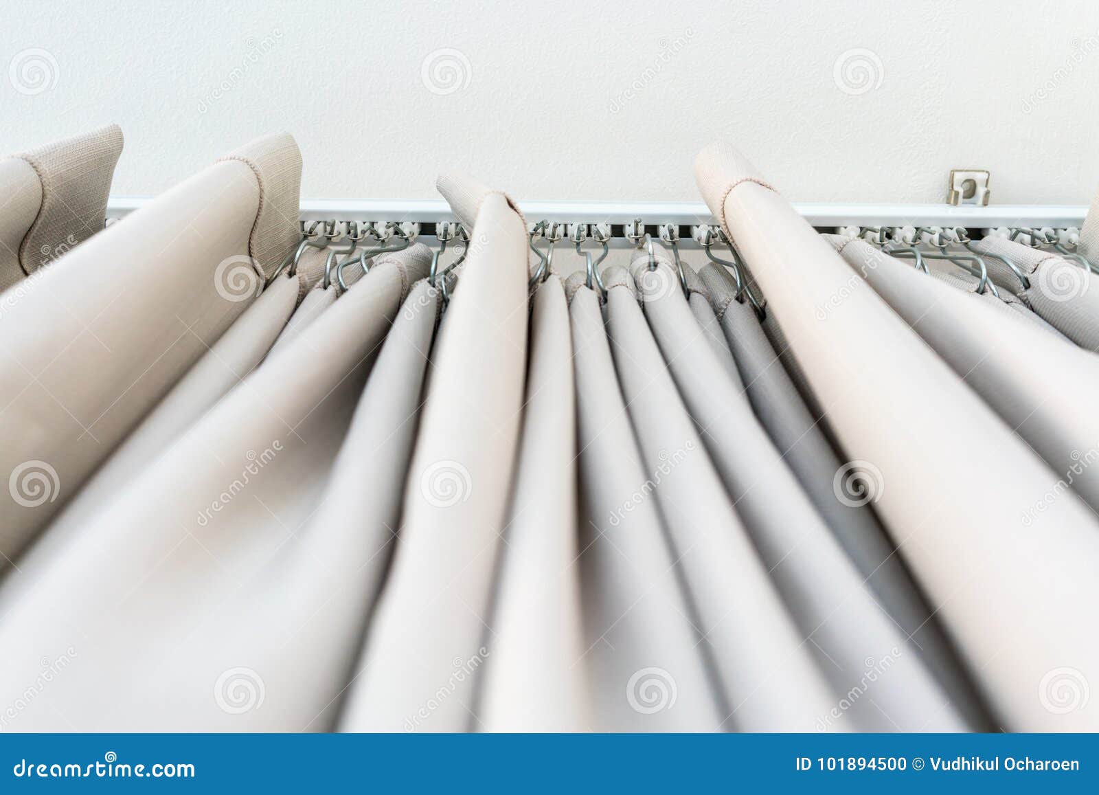 White Curtain Rail System with Light Brown Curtain Stock Photo - Image ...