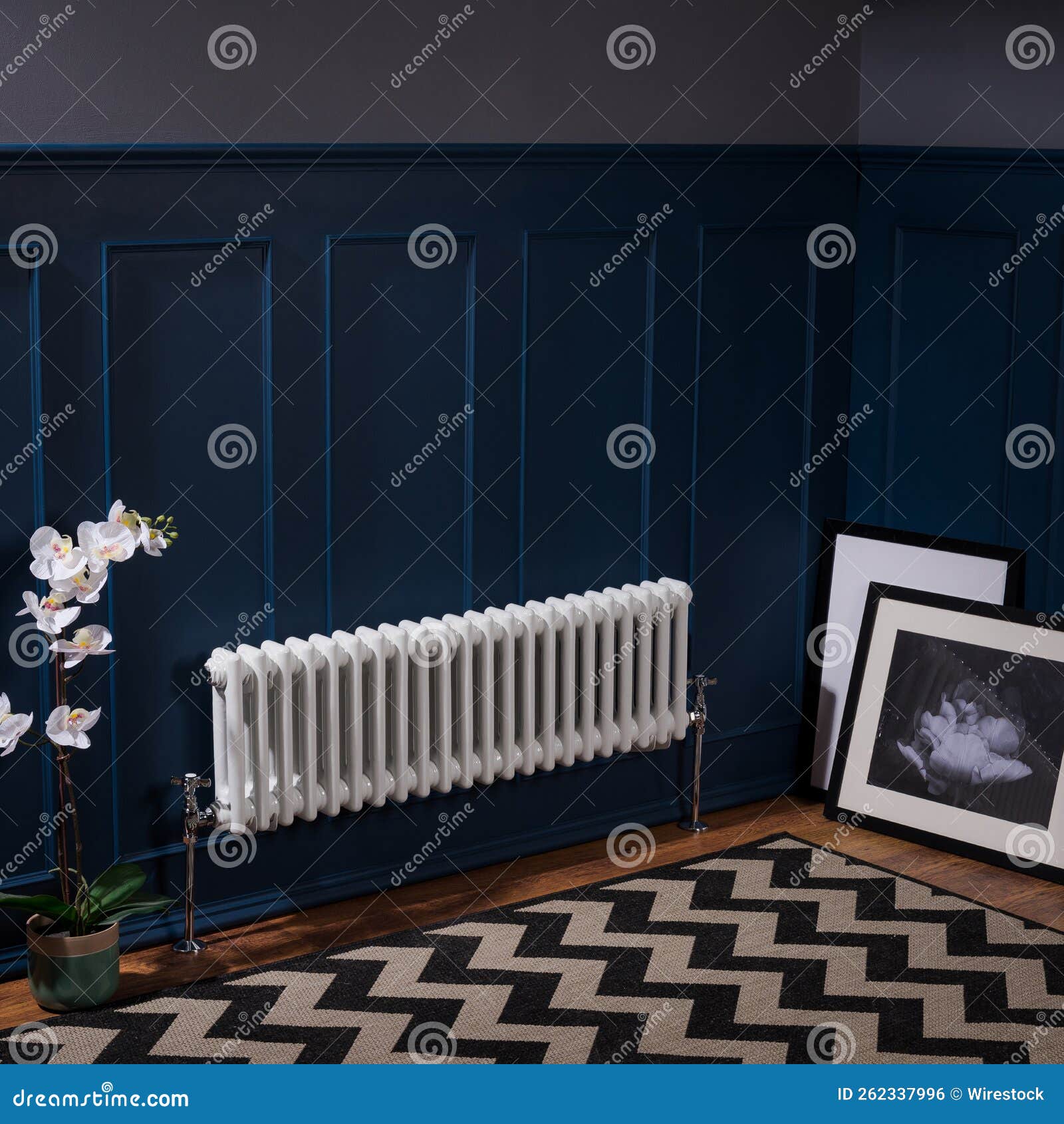 White Decorative Heater in a Renovated Modern Blue Room Stock Photo ...