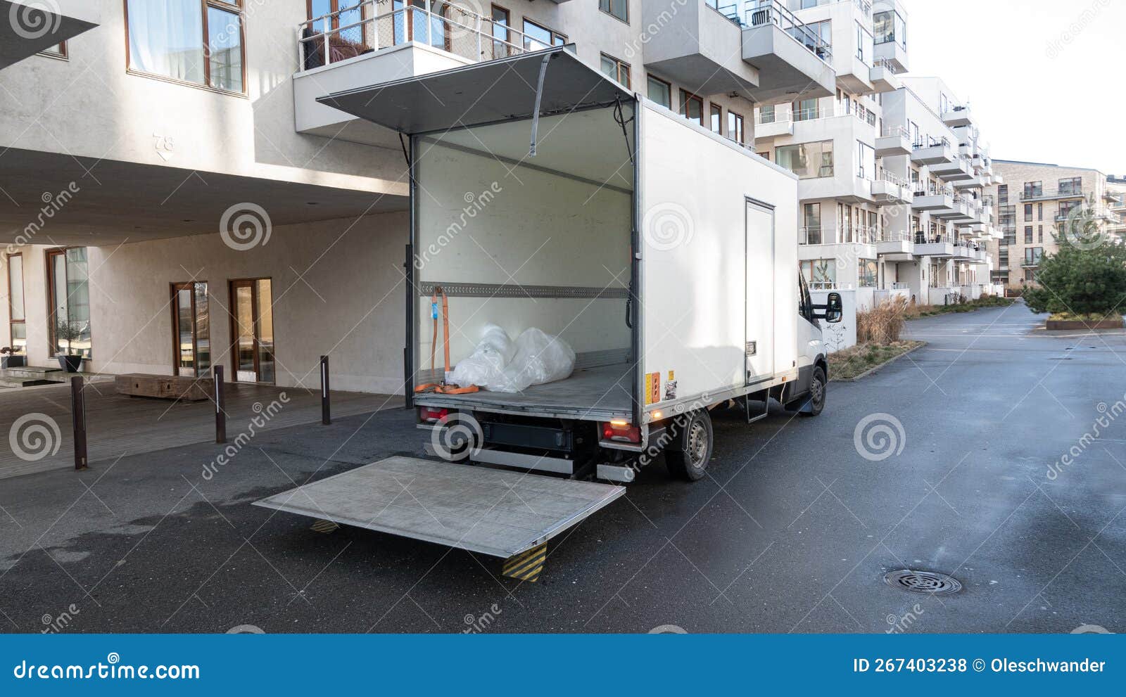 Delivery Truck with Tailgate Open in Front of a Building Stock Photo ...