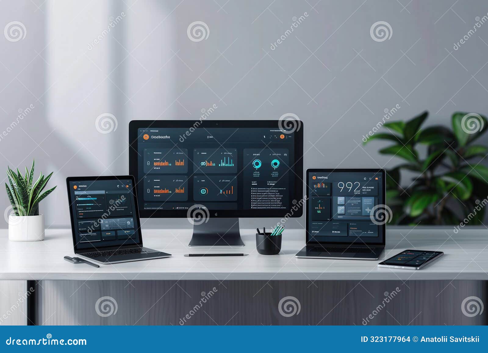 White Desk with Computer, Laptop, and Tablet Displaying Vibrant ...