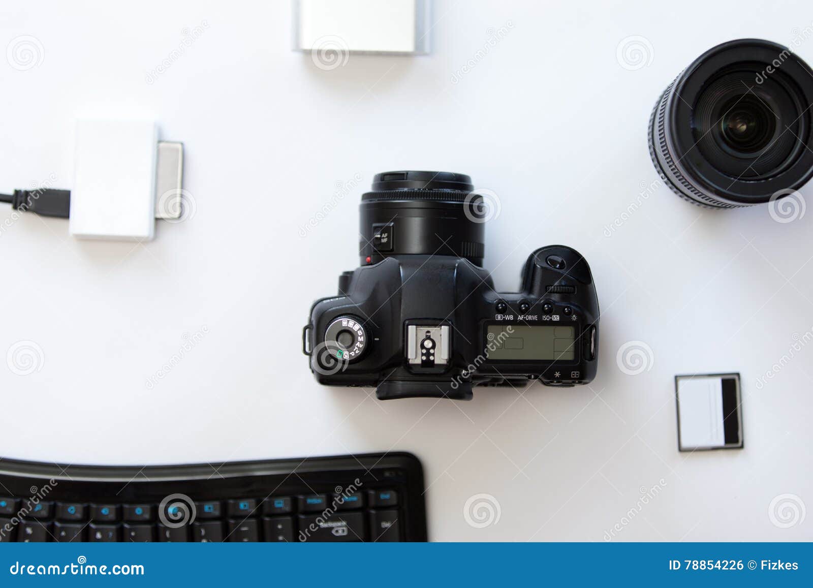 White Desk with a Professional Camera and Accessoires Stock Photo ...