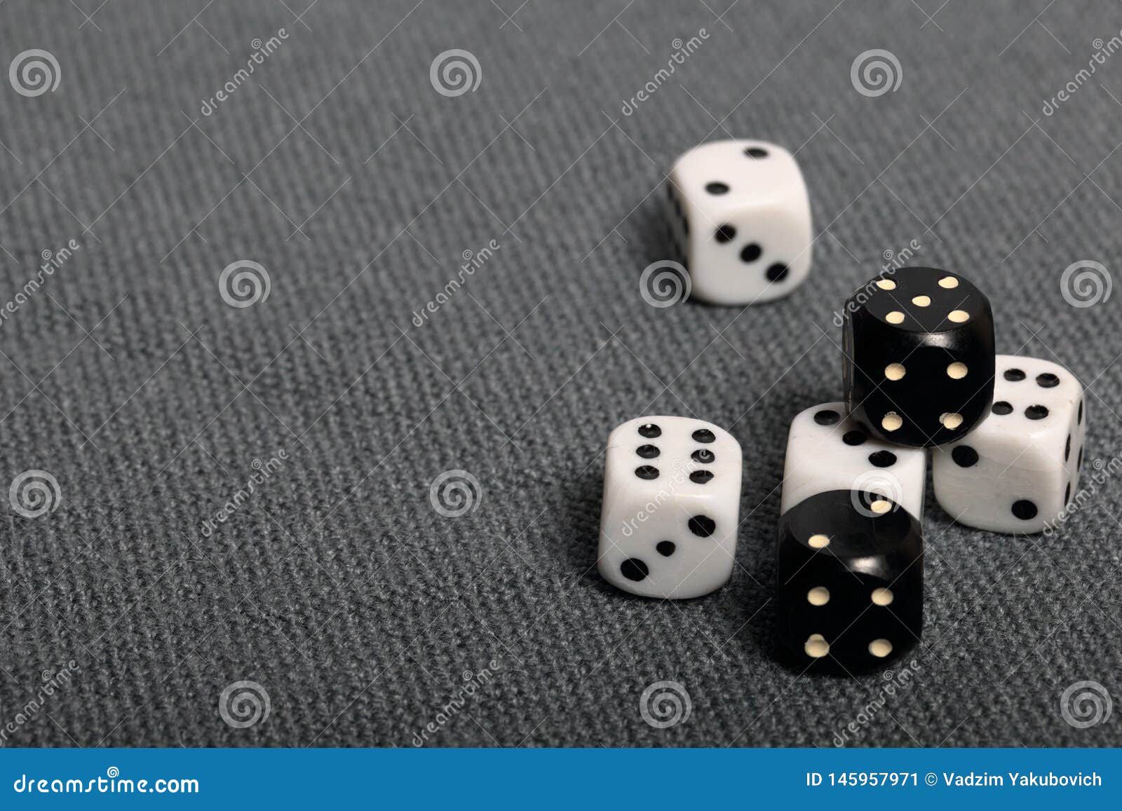 White Dice with Black Markings. they Lie on a Surface Covered with a ...