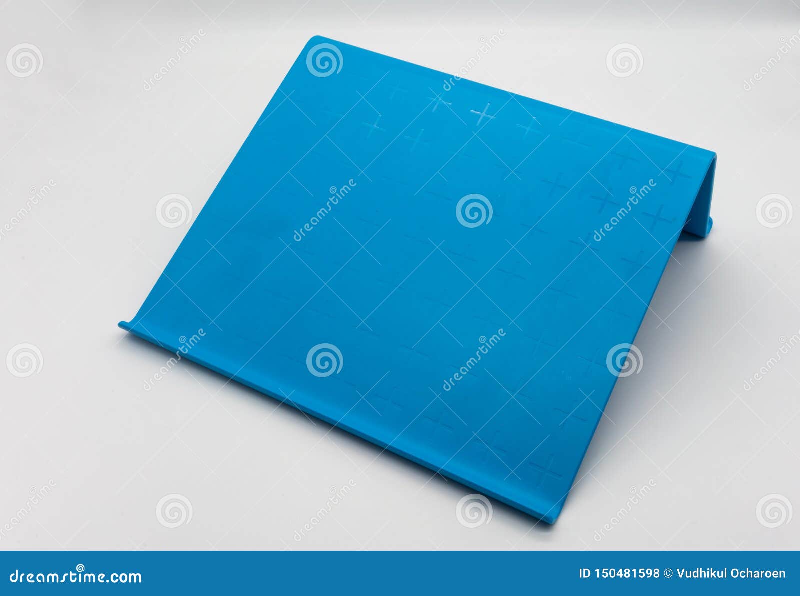 White Digital Tablet on Blue Plastic Tablet Stand Isolated on White ...