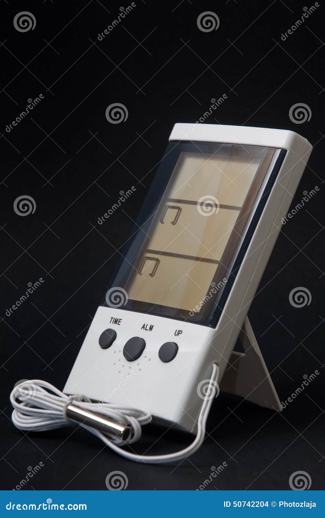 White Digital Thermometer with a Sensor on a Black Background Stock ...