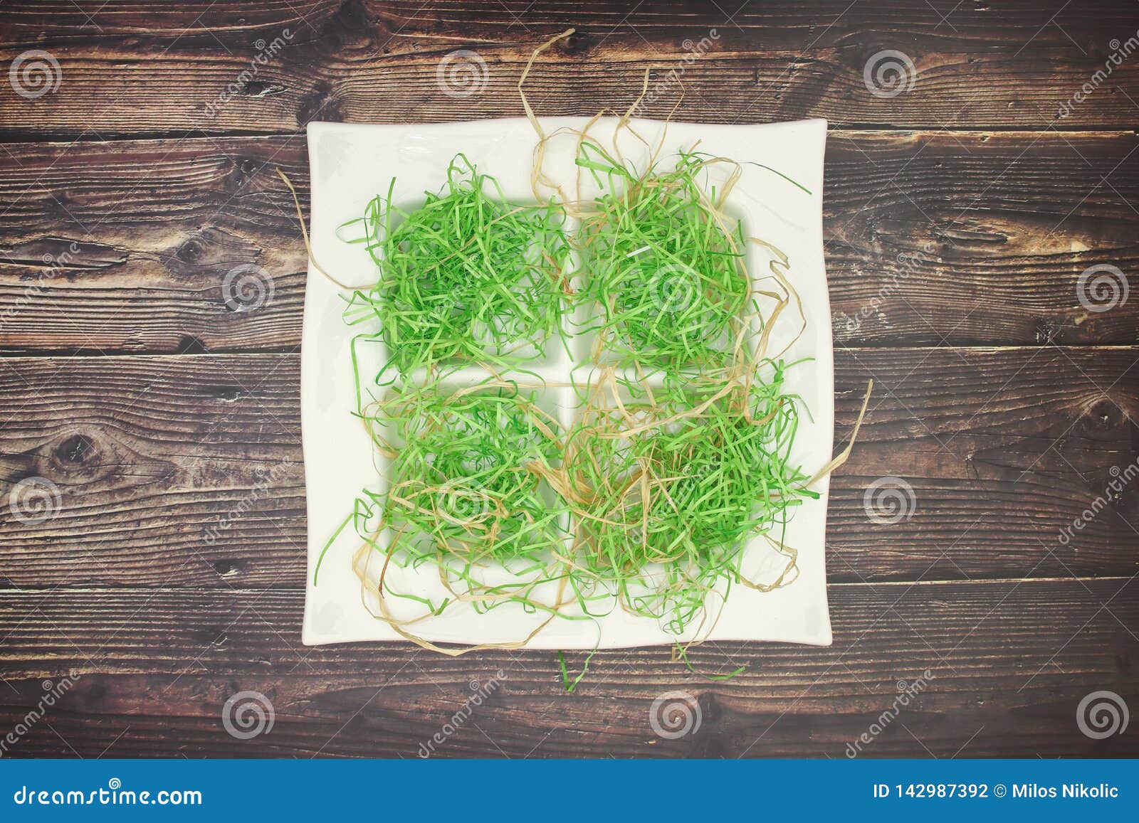 White Dish and Green Grass in the Center of the Table Stock Photo ...