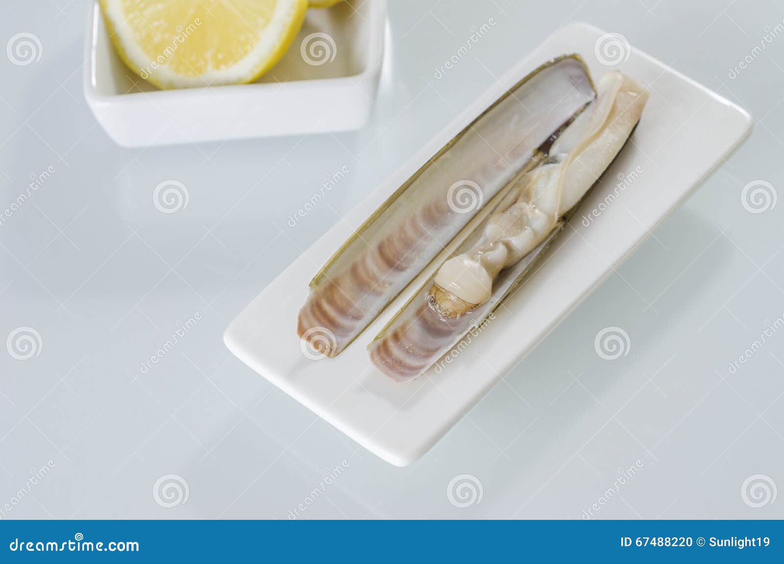 White Dish of Grilled Razor Clams with Lemon Stock Photo - Image of ...