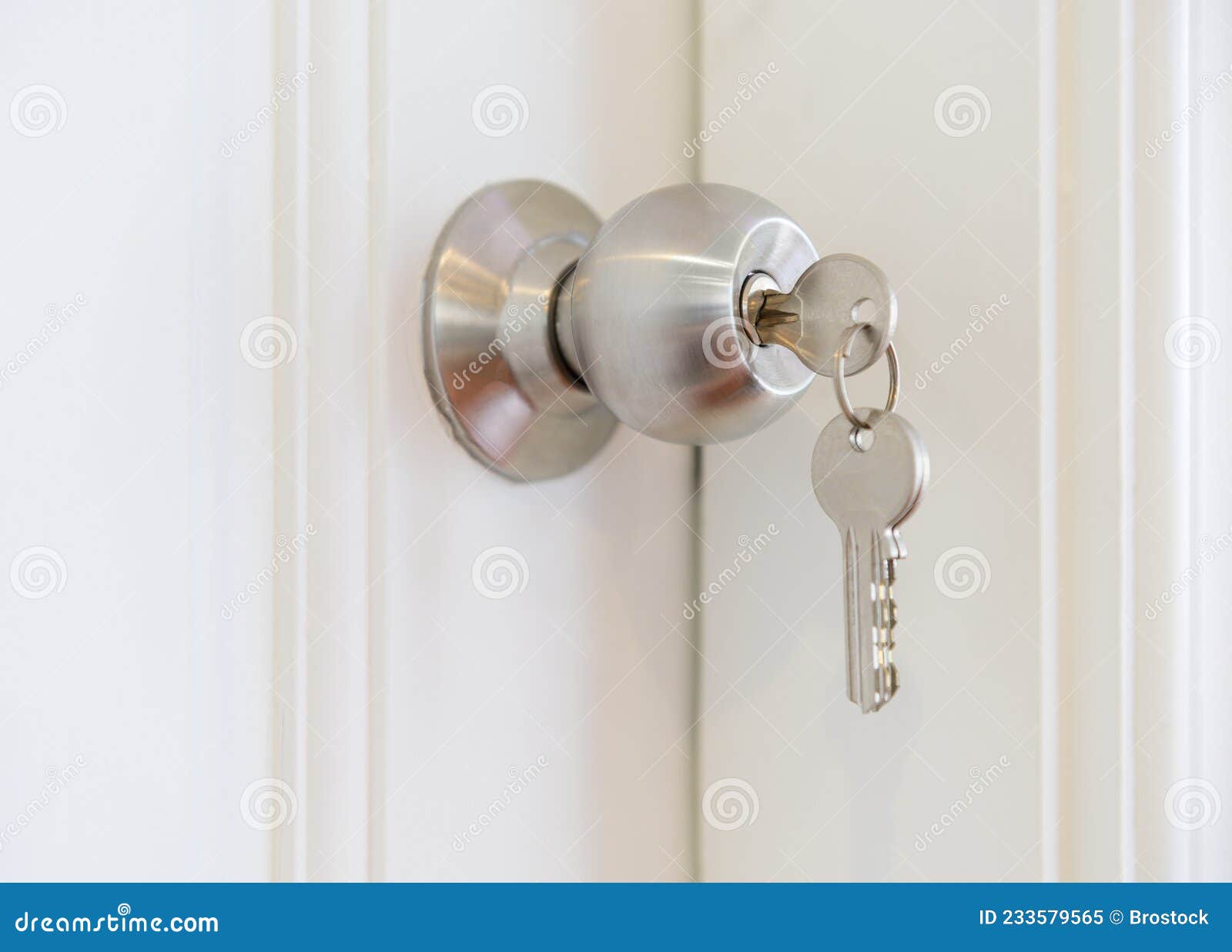 White Doors Knob with Key on Slot Stock Image - Image of open, doors ...