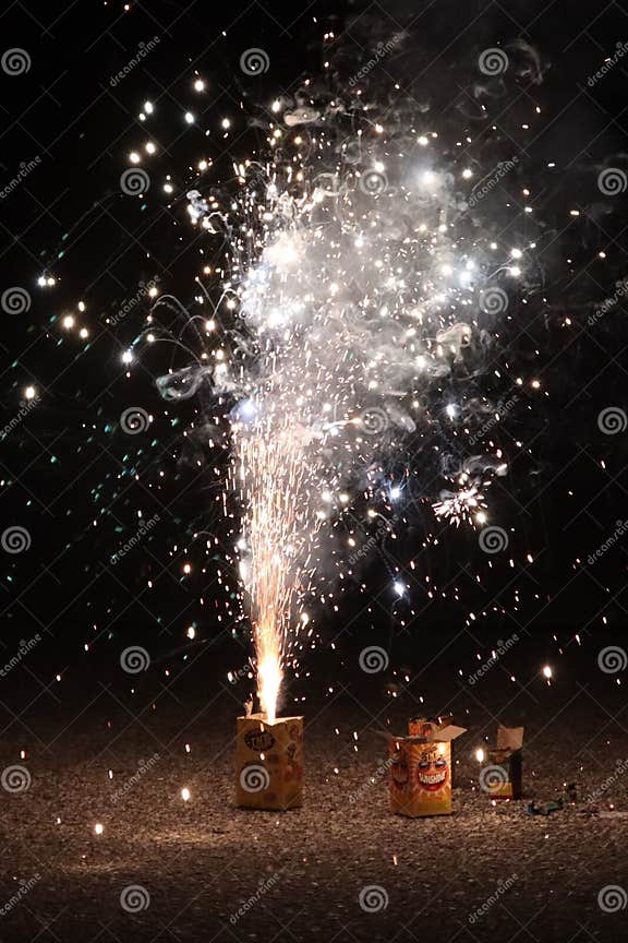 White Dot and Red Spray Fireworks on Cement Stock Photo - Image of ...