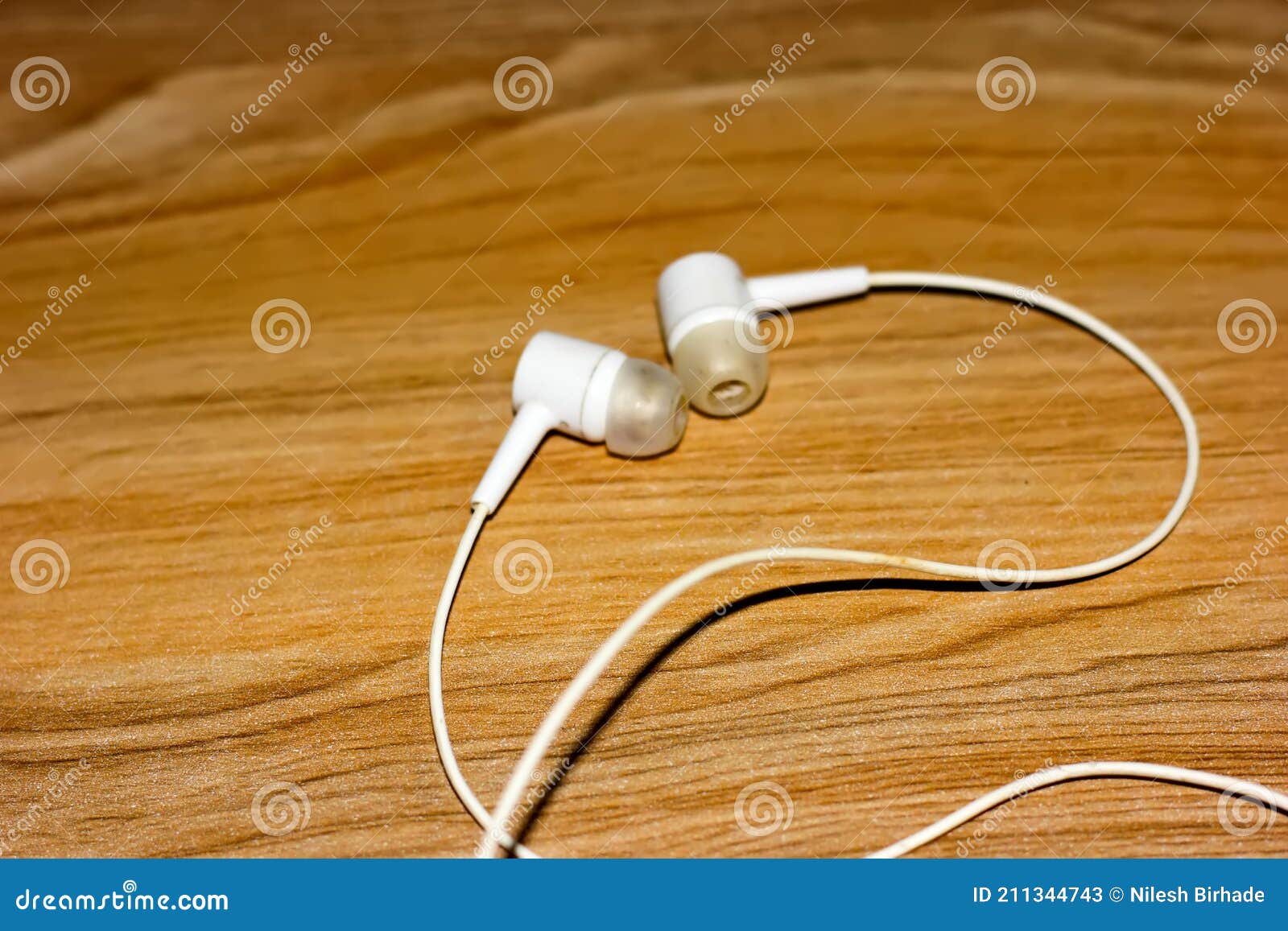 White Earphones on a Table Background Stock Image - Image of device ...