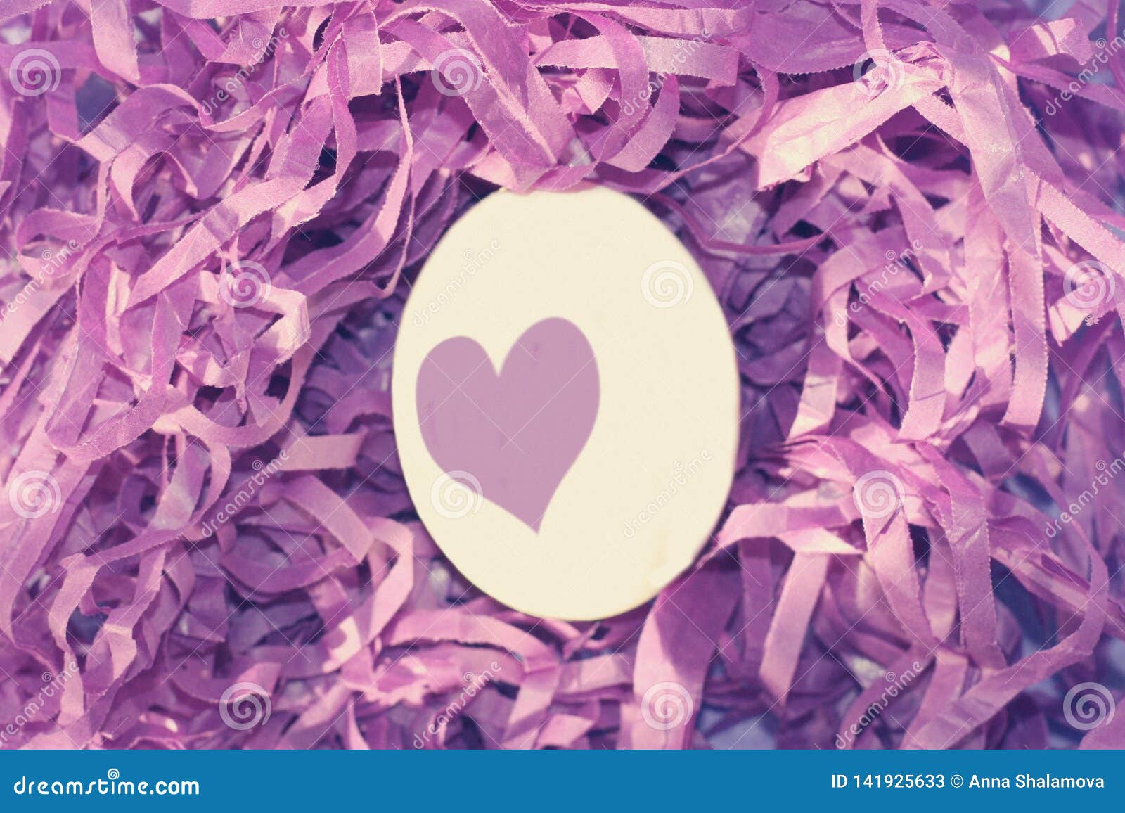 White Easter Egg with a Light Purple Heart on the Background of the ...