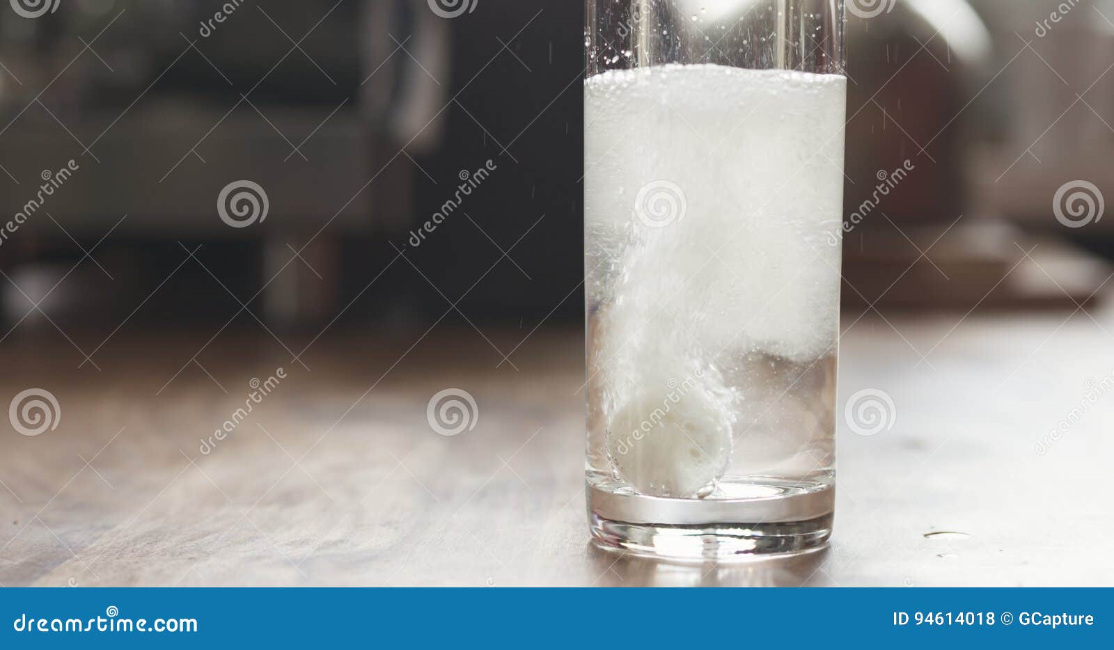White Effervescent Tablet in Glass with Water on Table Stock Photo ...