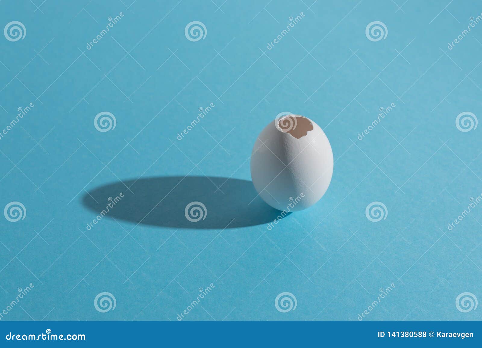 White Egg Shell on Bright Blue Background. Minimal Easter Concept Stock ...