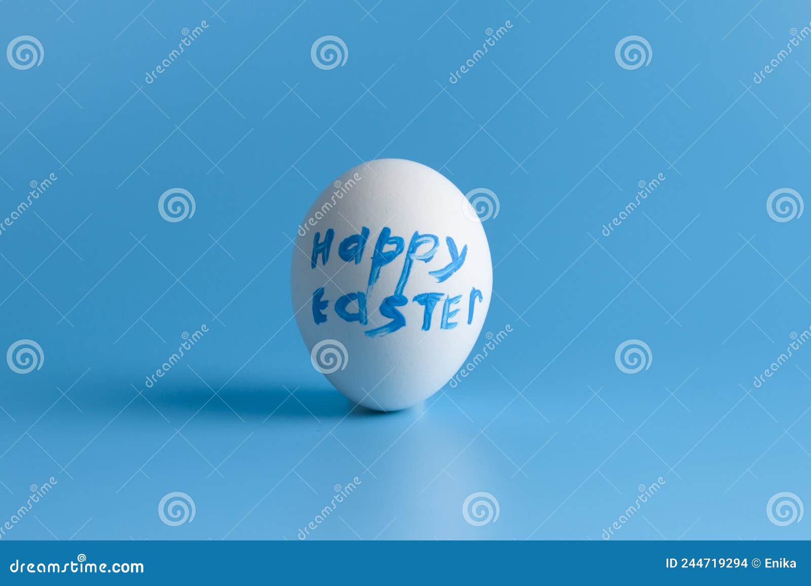 White Egg with Text on a Blue Background Stock Photo - Image of dinner ...