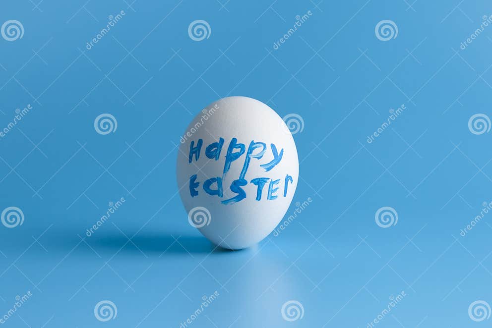 White Egg with Text on a Blue Background Stock Photo - Image of dinner ...