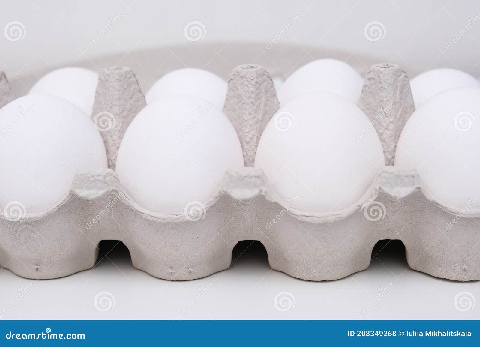 White Eggs in Recycled Carton Pressed Box Container on White Table ...