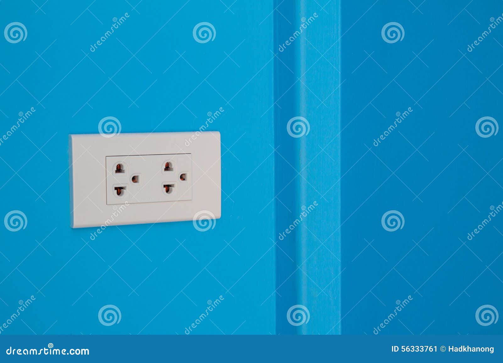 White Electric Outlet Mounted on Blue Wall Stock Image - Image of plug ...